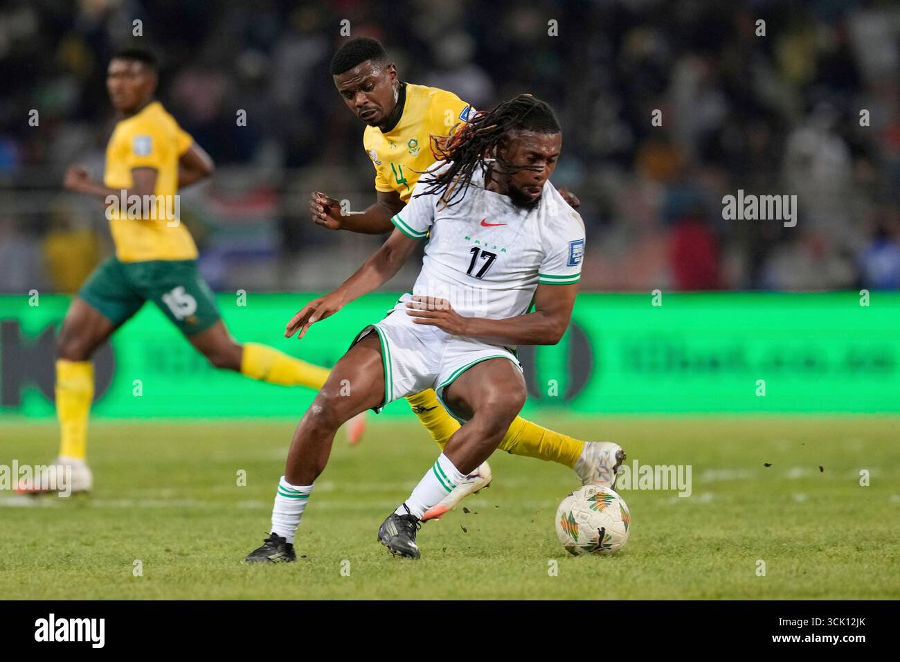 Nigeria's Alex Iwobi, right, challenges for the ball with South Africa ...