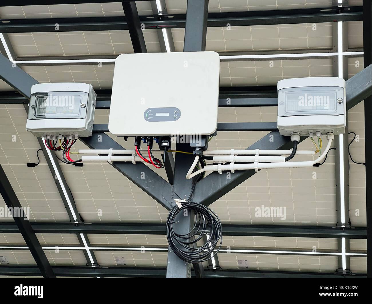 Solar power inverter and electrical boxes installed below solar panels ...