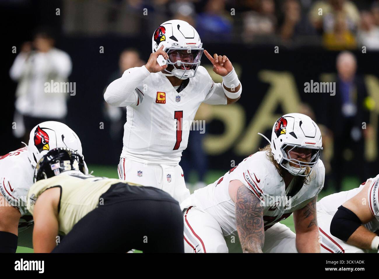 Arizona Cardinals quarterback Kyler Murray (1) checks off at the line ...