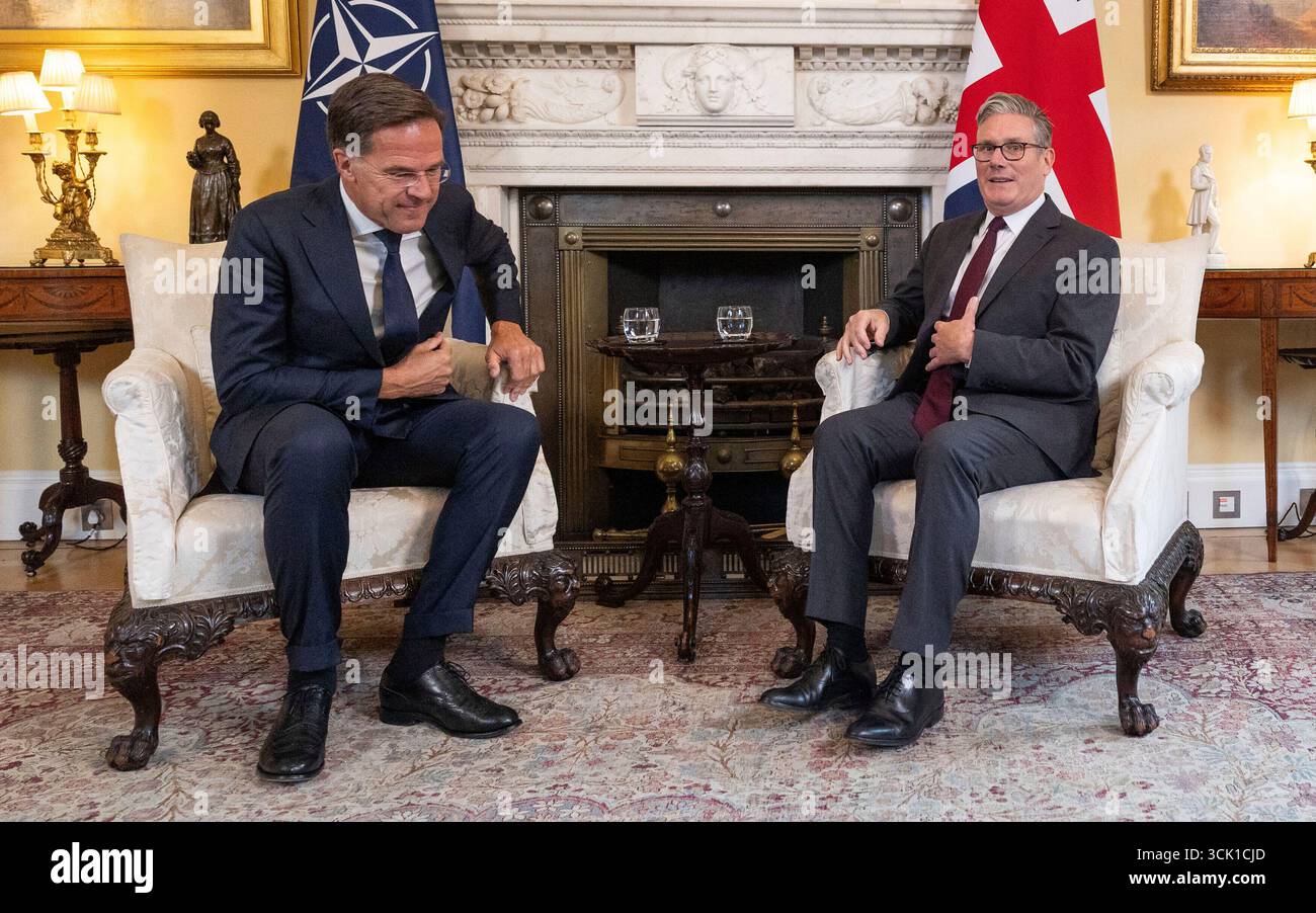 Britain's Prime Minister Sir Keir Starmer, right, and NATO Secretary ...