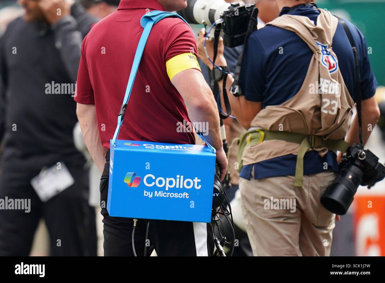 An NFL official holds a Microsoft Copilot Replay Monitor on the ...