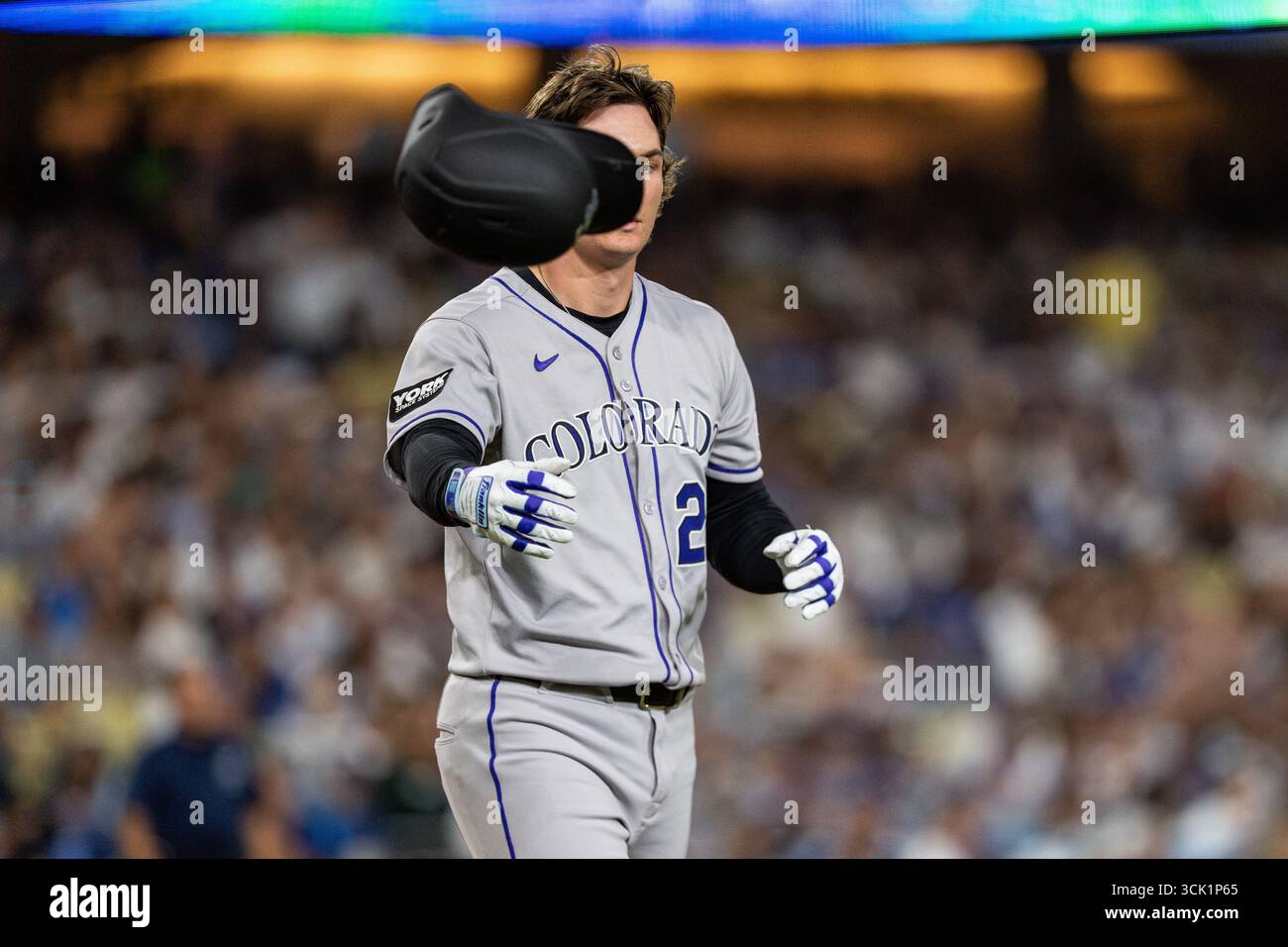 Colorado Rockies outfielder Mickey Moniak (22) tosses his helmet during ...