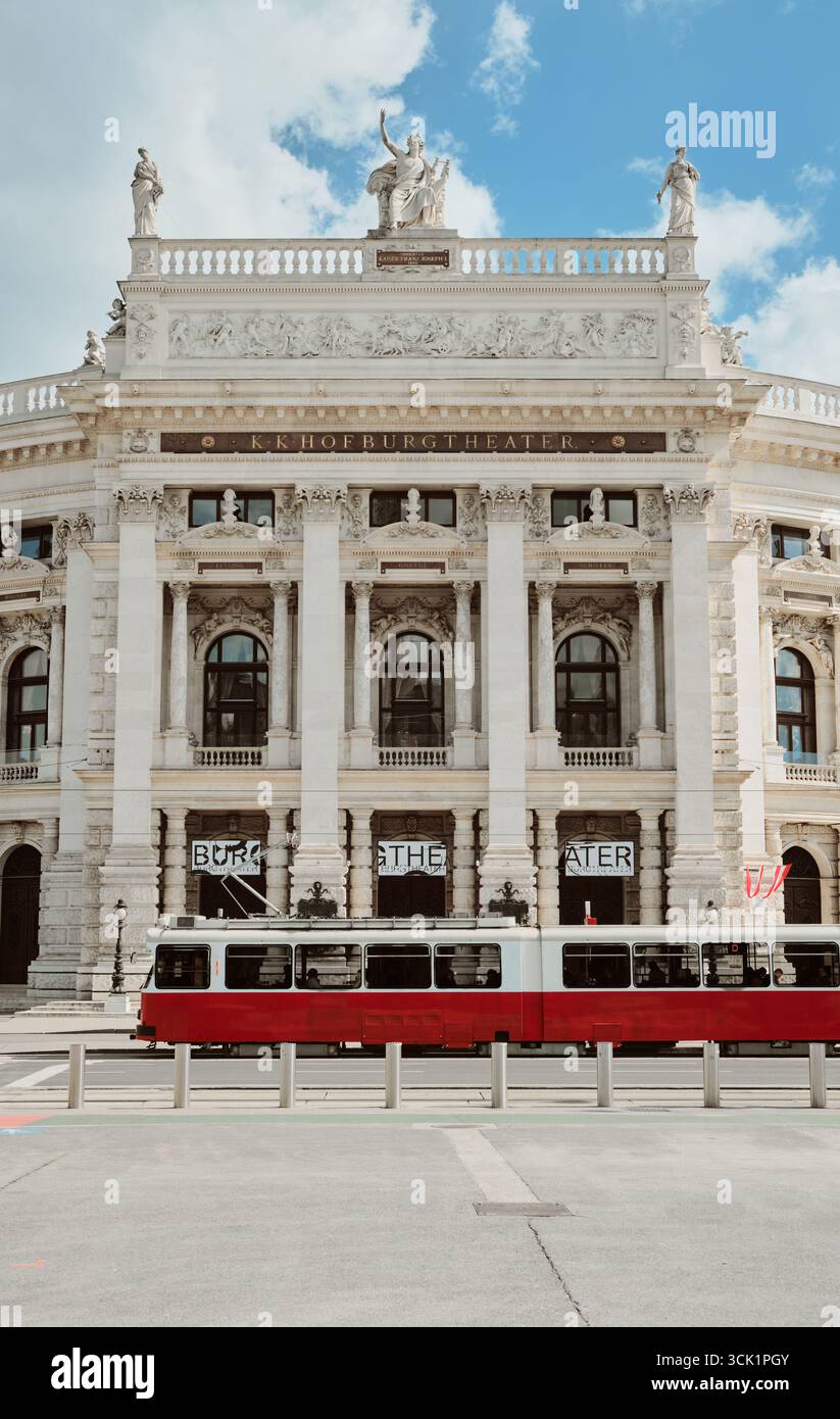 View of the historic Burgtheater in Vienna on a sunny day with a red ...