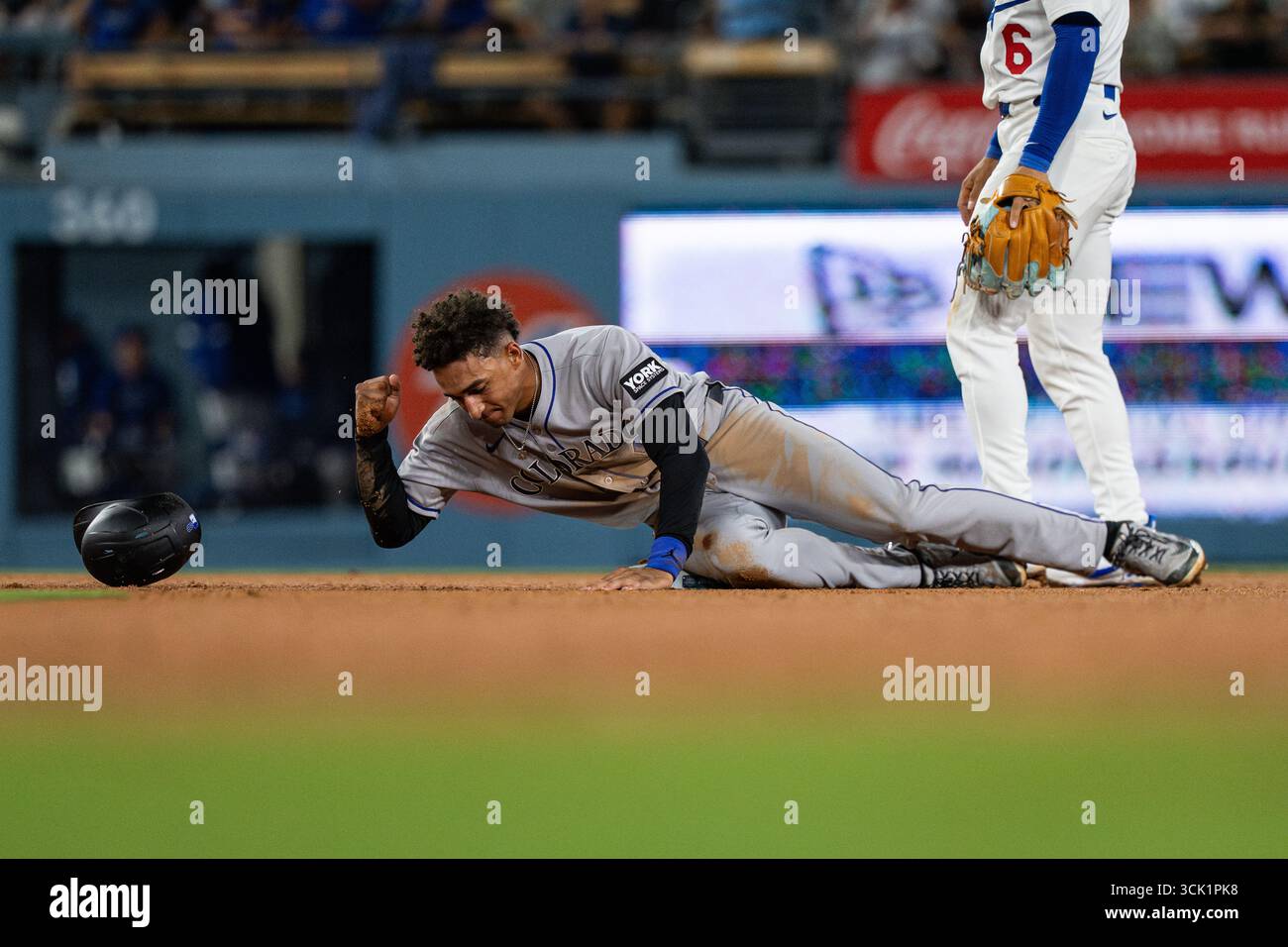 Colorado Rockies shortstop Ryan Ritter (8) reacts after suffering an ...