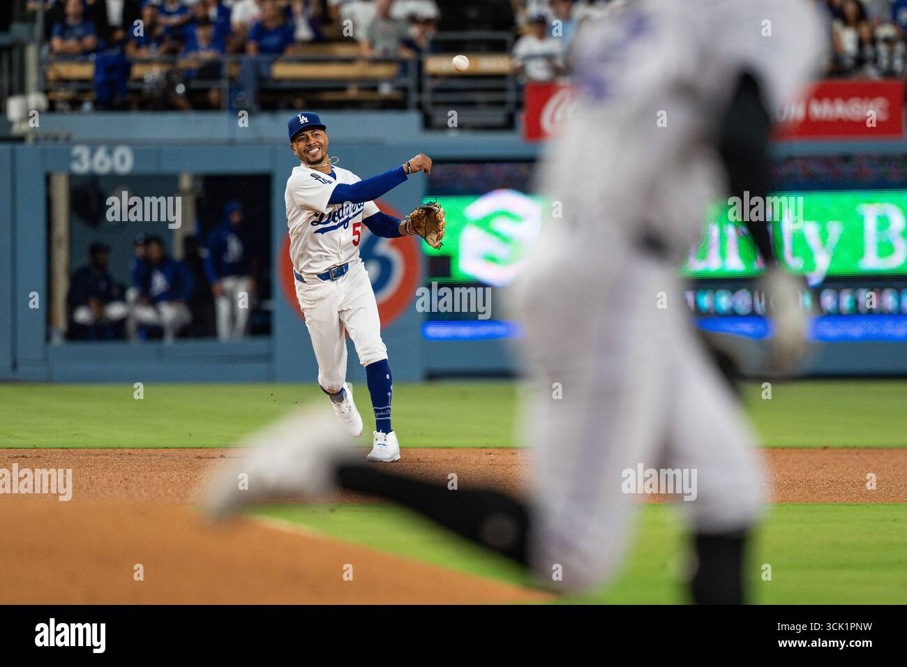 Los Angeles Dodgers shortstop Mookie Betts (50) throws to first base ...