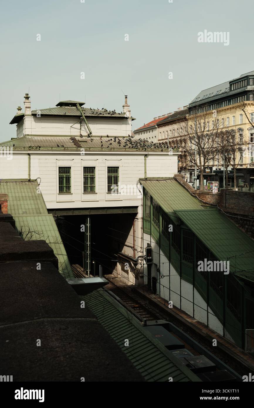View of a historic Vienna subway station featuring green tiled walls ...