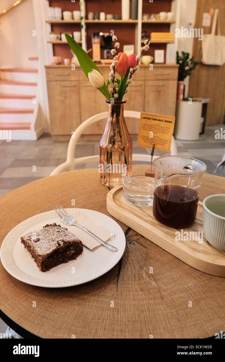 Cozy café scene on wooden table slice with white plate holding ...