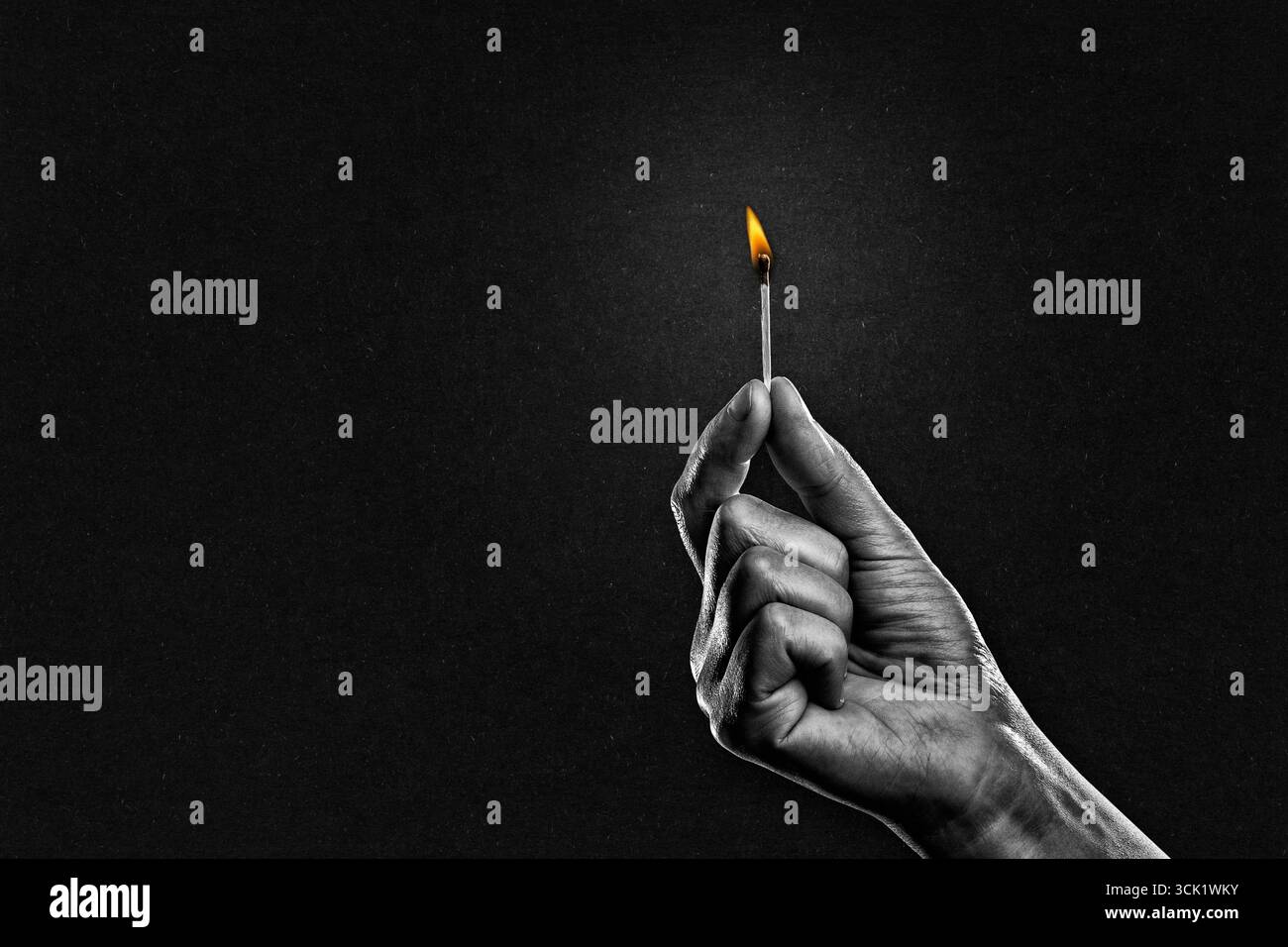 Hand holding lit match in hi-res stock photography and images - Alamy