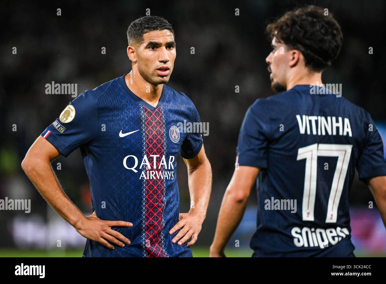 Paris, France. 22nd Aug, 2025. Achraf HAKIMI of PSG and Vitor MACHADO ...