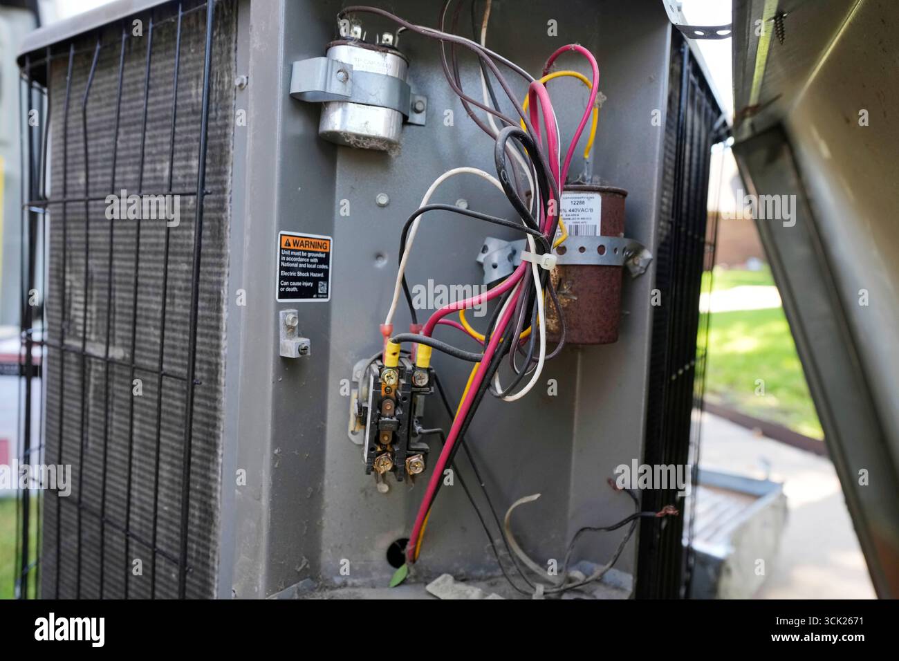 Old equipment sits by a work truck as Homstead Heating and Air ...