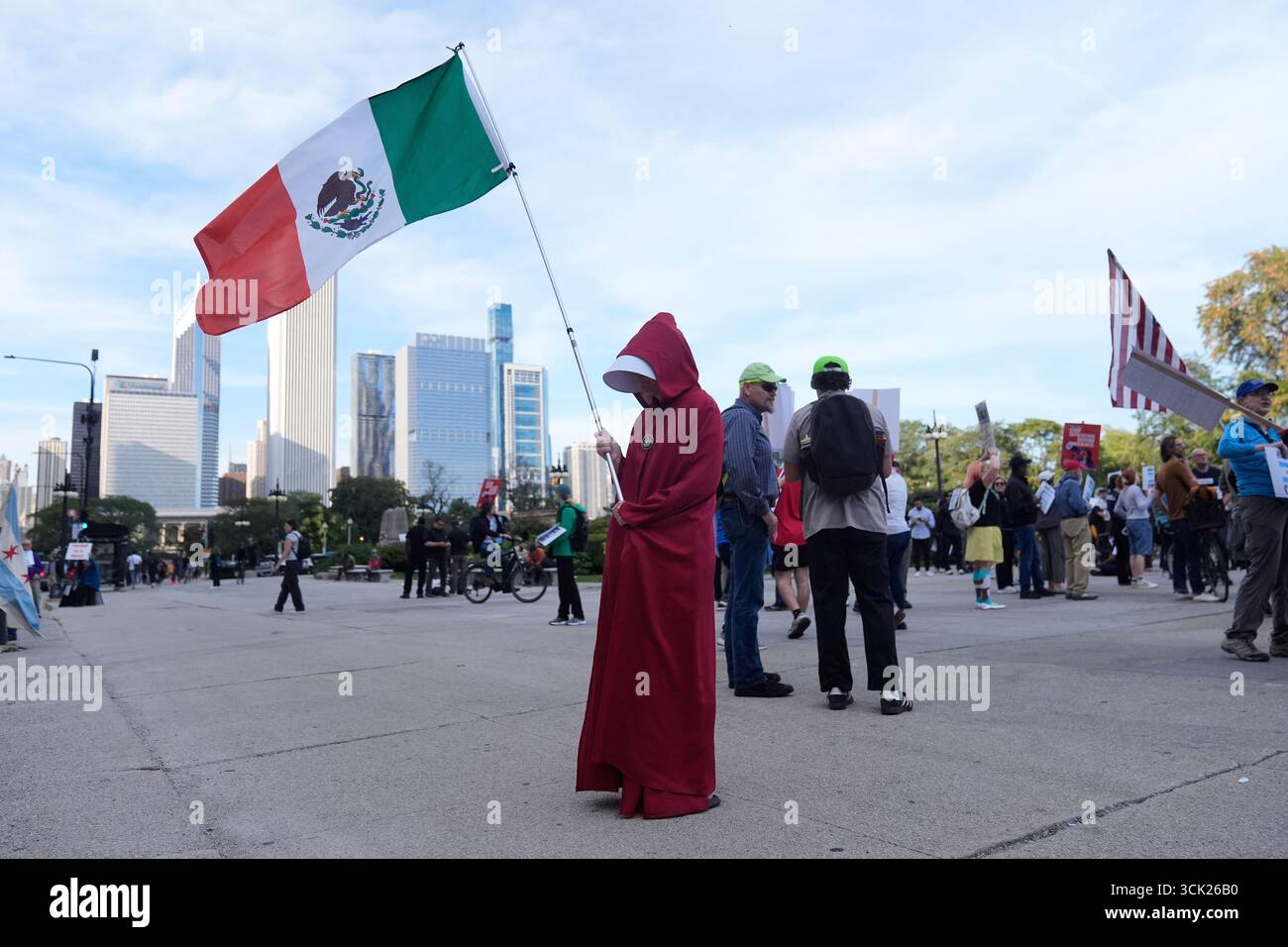 Jenny Golden, of Bartlett, Ill., holds a Mexican flag at a protest ...