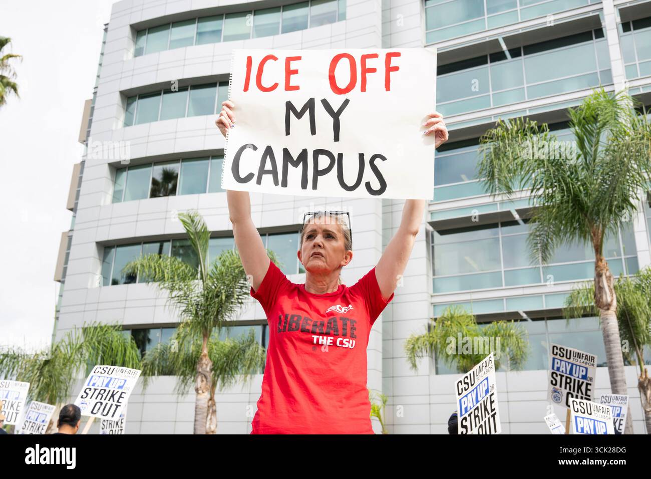 Corrie Roozee of Cal State San Bernardino joins in a rally outside the ...