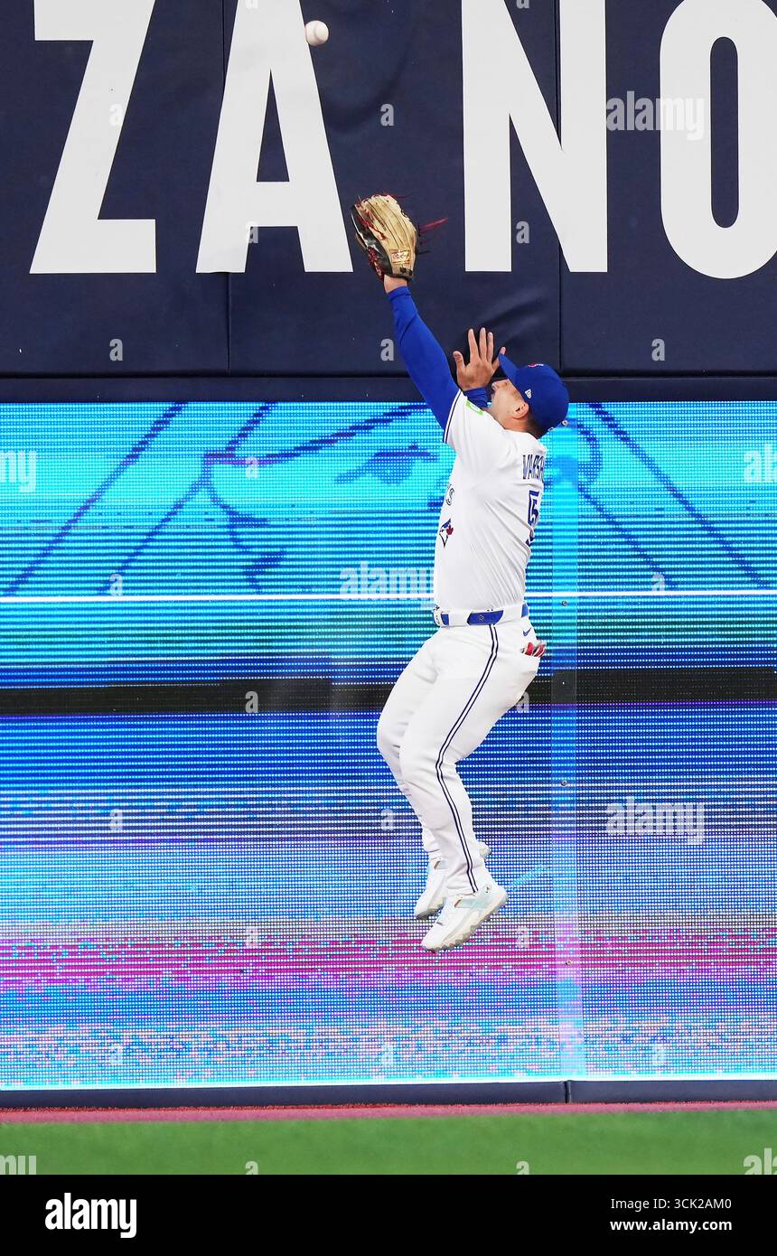 Toronto Blue Jays outfielder Daulton Varsho (5) can't make a catch on a ...