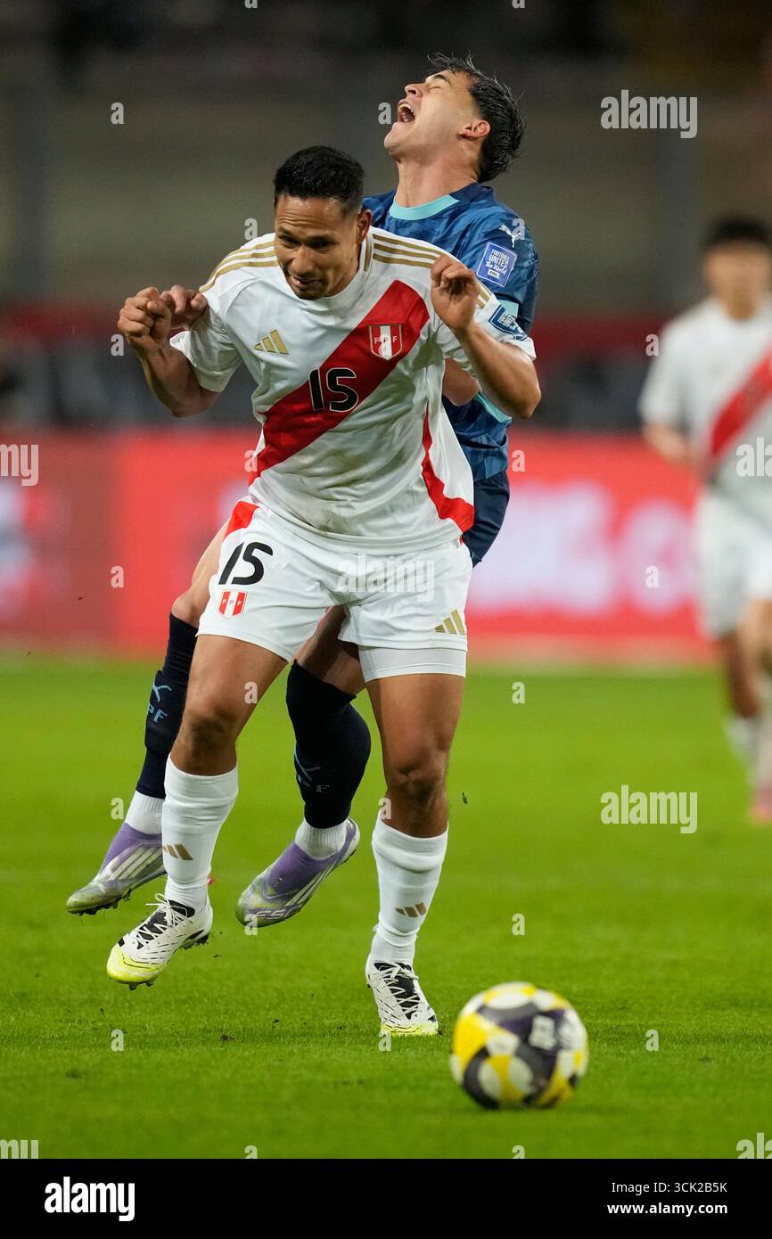 Peru's Renzo Garces, front, battles for the ball with Paraguay's Ramon ...