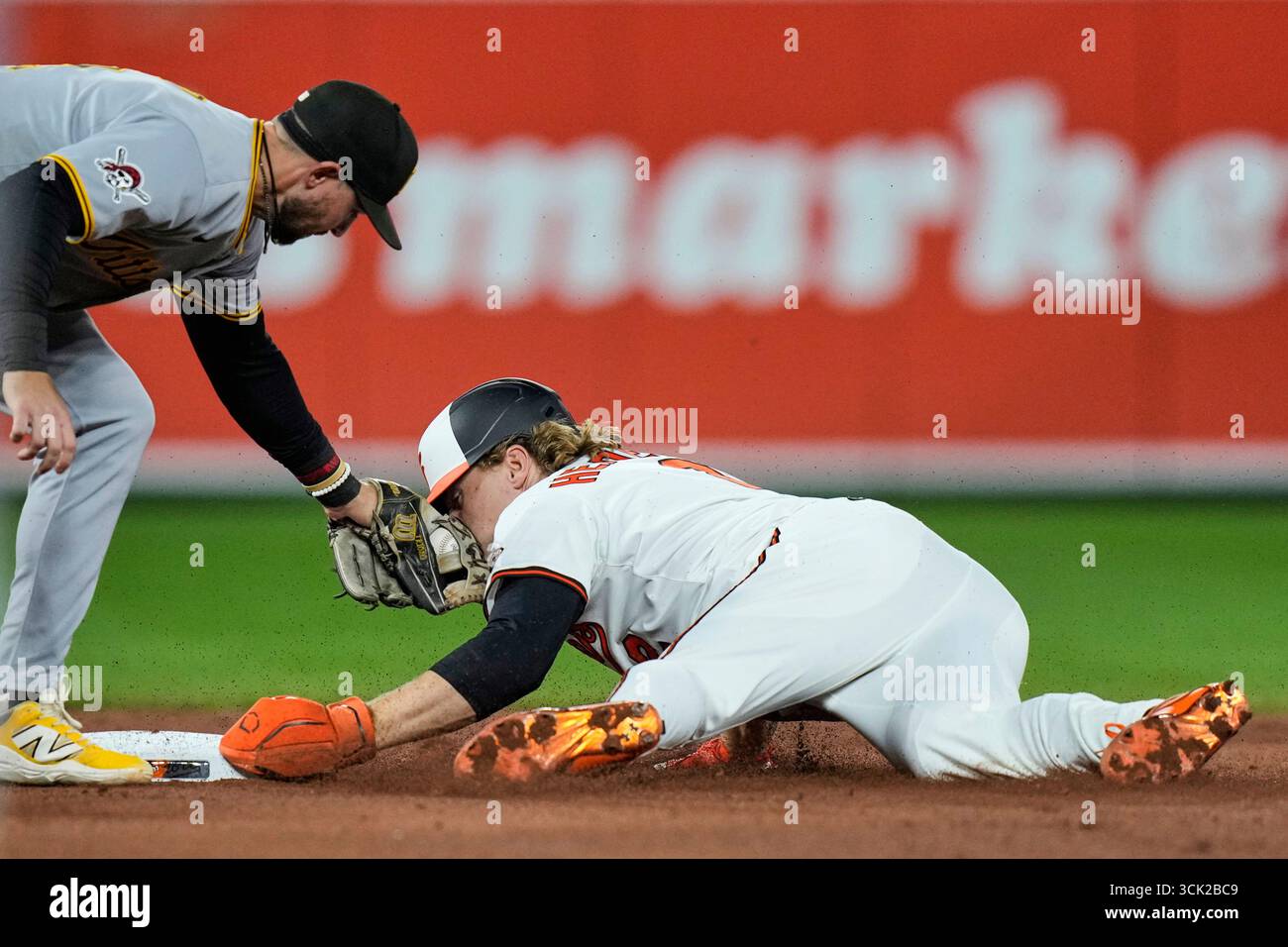 Baltimore Orioles' Gunnar Henderson, right, steals second base past ...