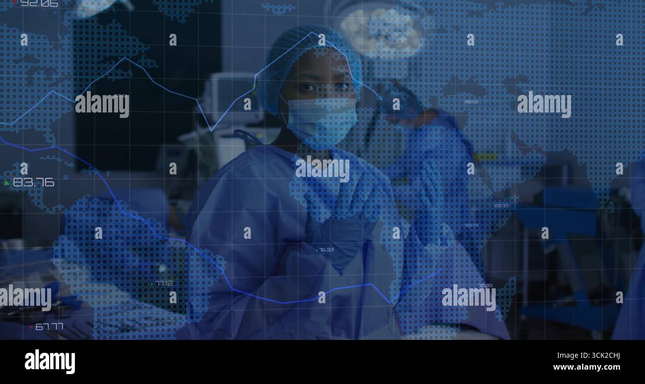 Standing surgeon wearing mask monitoring data overlays in operating ...