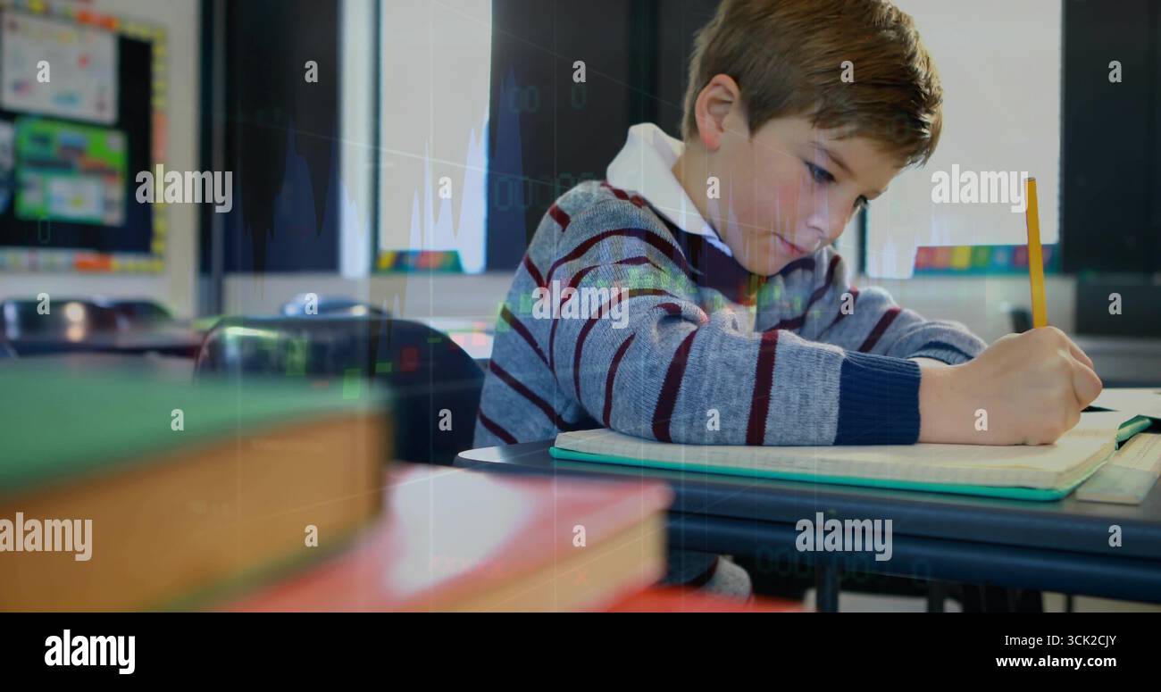 Writing student wearing striped sweater using pencil at school desk ...