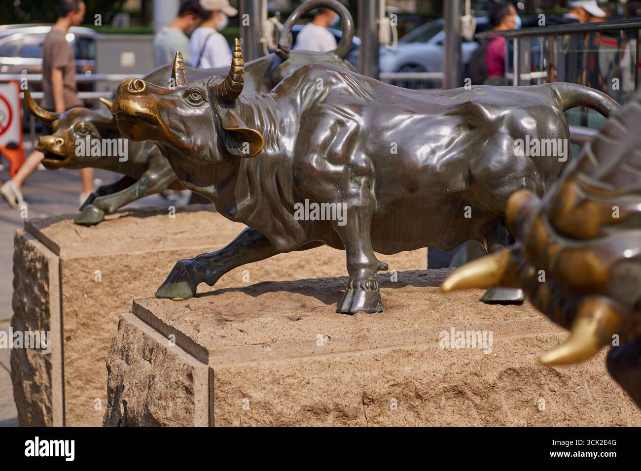 Chinese bull bronze statues– street art near Wangfujing shopping street ...