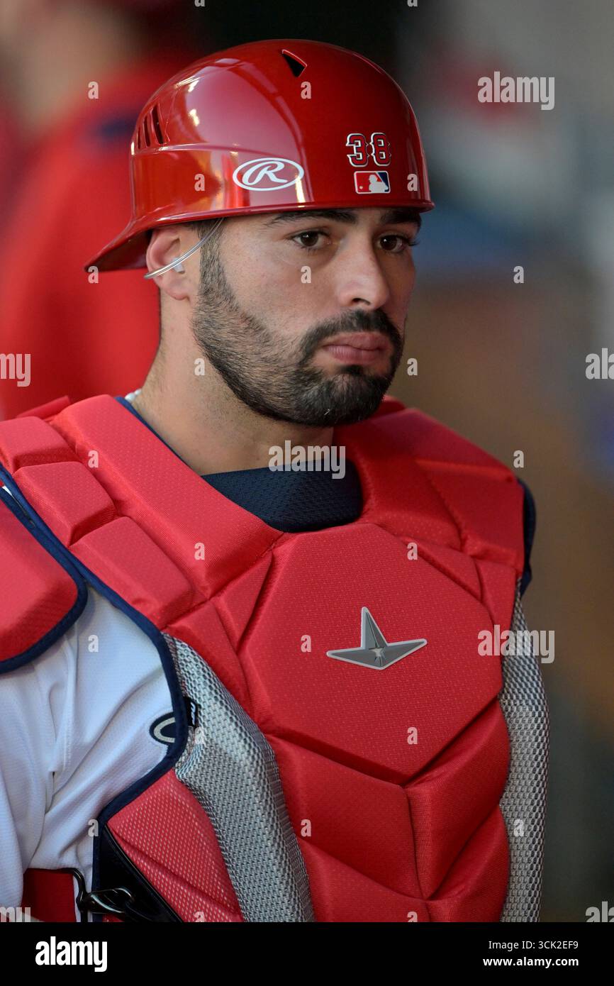 Los Angeles Angels Sebastian Rivero looks on from the dugout during a baseball game against the ...