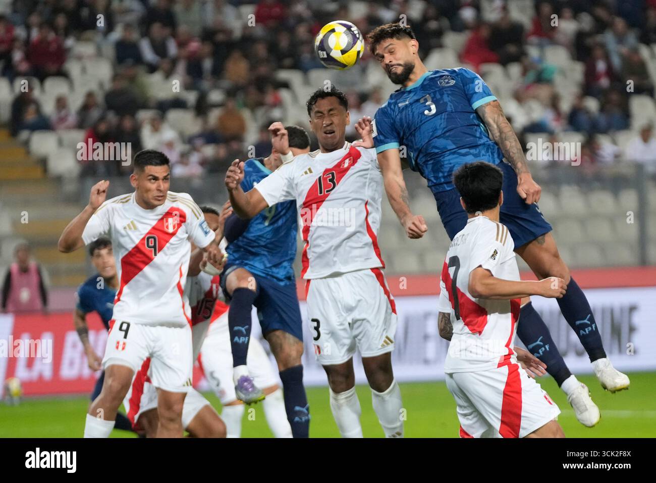 Paraguay's Omar Alderete, right, heads the ball past Peru's Erik ...