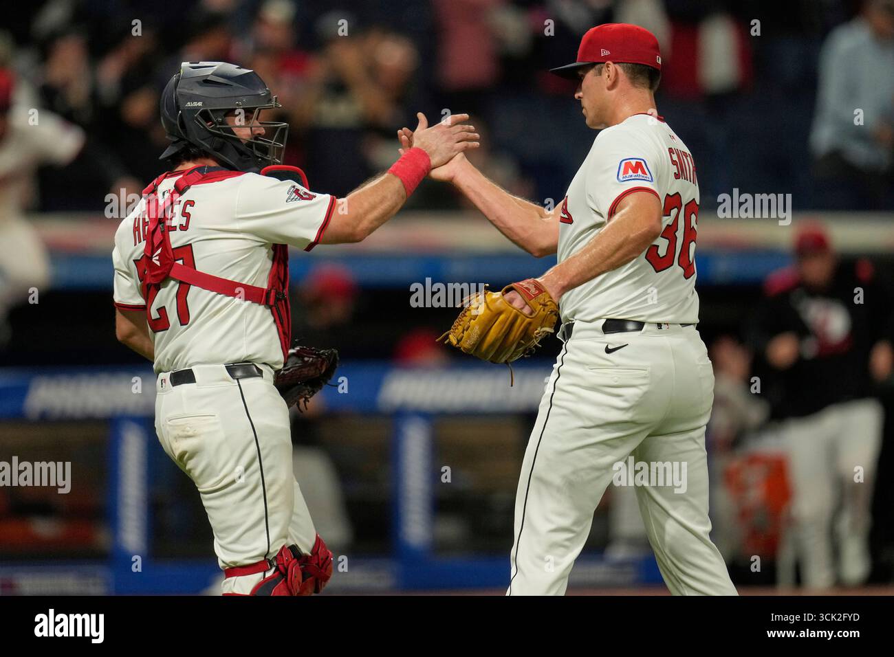 Cleveland Guardians catcher Austin Hedges (27) and relief pitcher Cade ...