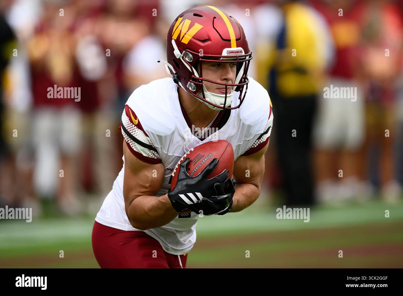Washington Commanders wide receiver Luke McCaffrey (11) warms up before ...