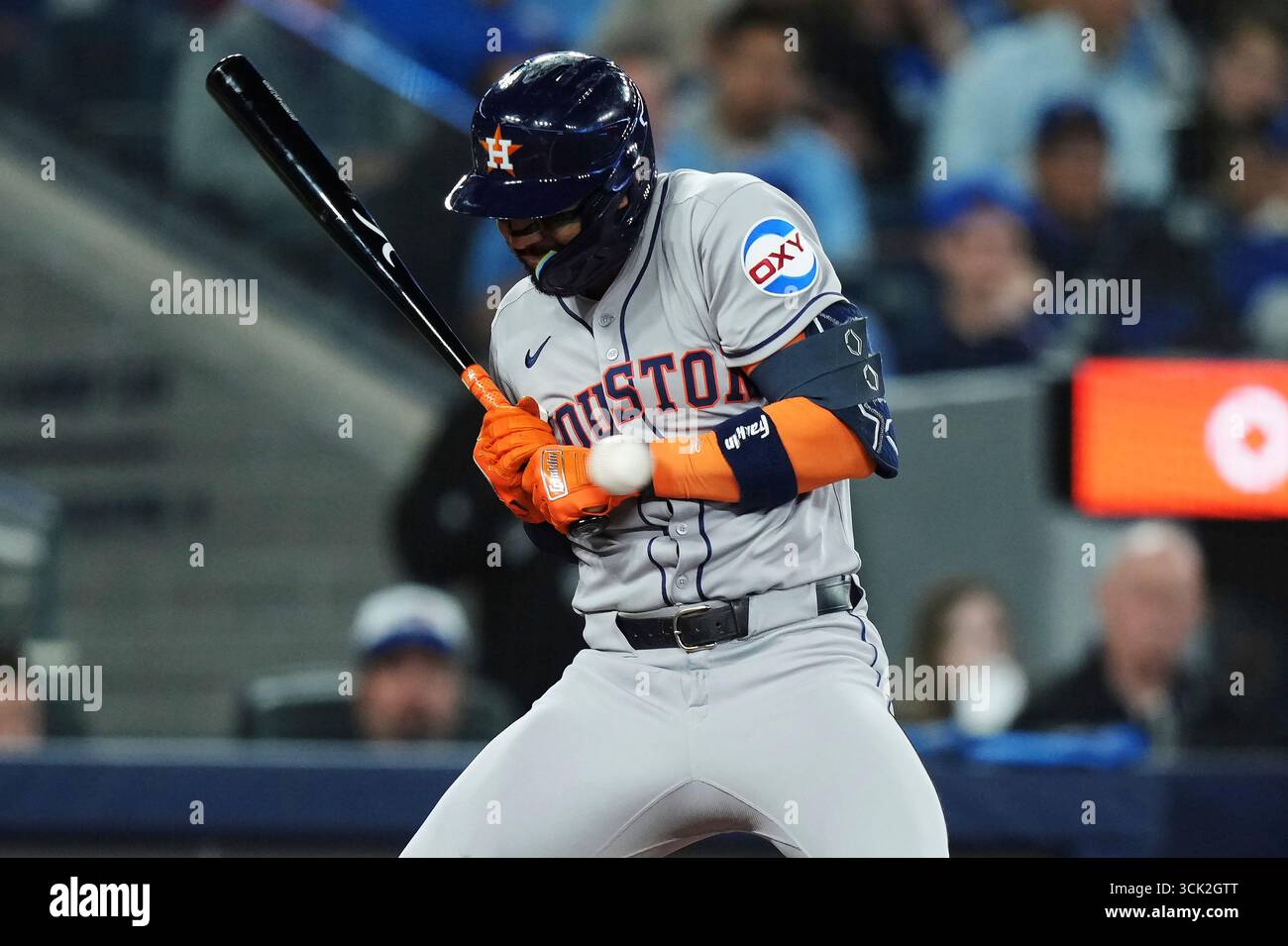 Houston Astros' Carlos Correa (1) is hit by a pitch against the Toronto ...