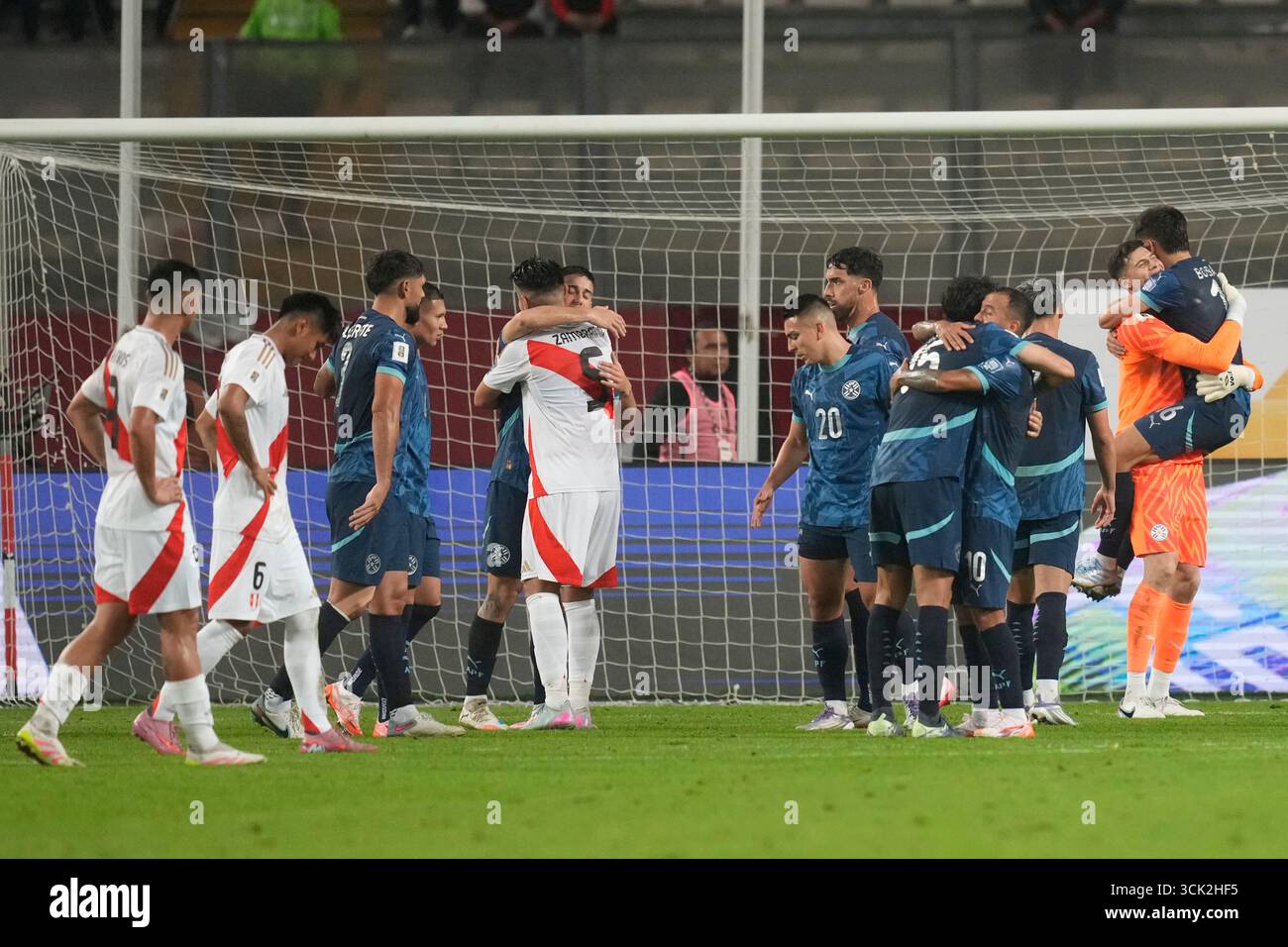 Paraguay's players, right, celebrate after beating Peru in a World Cup ...