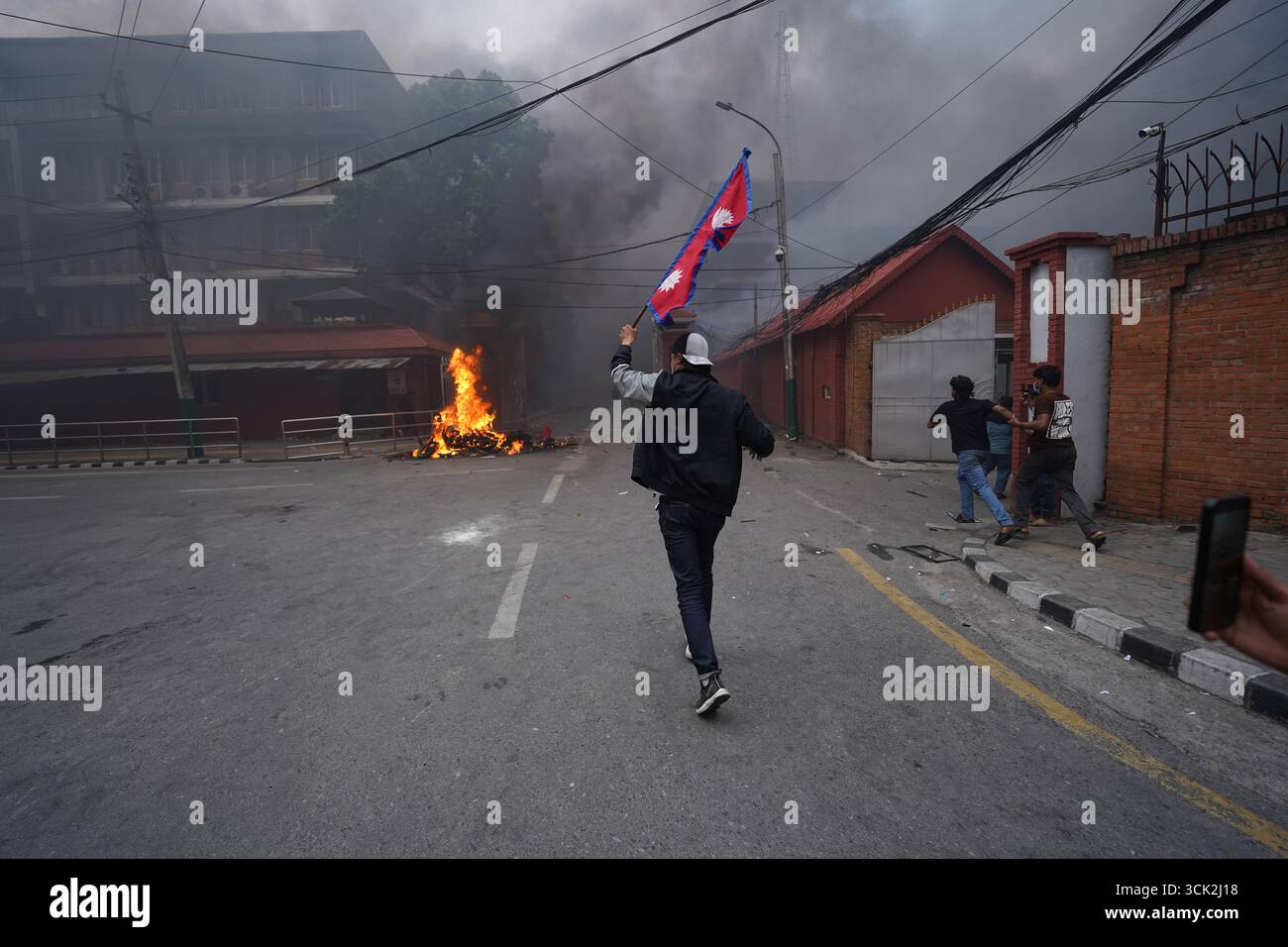 September 9, 2025, Kathmandu, Bagmati, Nepal: A Nepali protestor waves ...