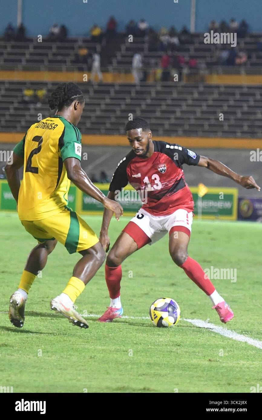 Trinidad and Tobago's Tyrese Spicer, right, attempts to get past ...
