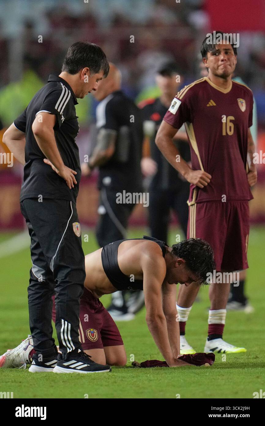 Venezuela's Jon Aramburu kneels next to teammate Jorge Yriarte (16) after their team's loss to ...