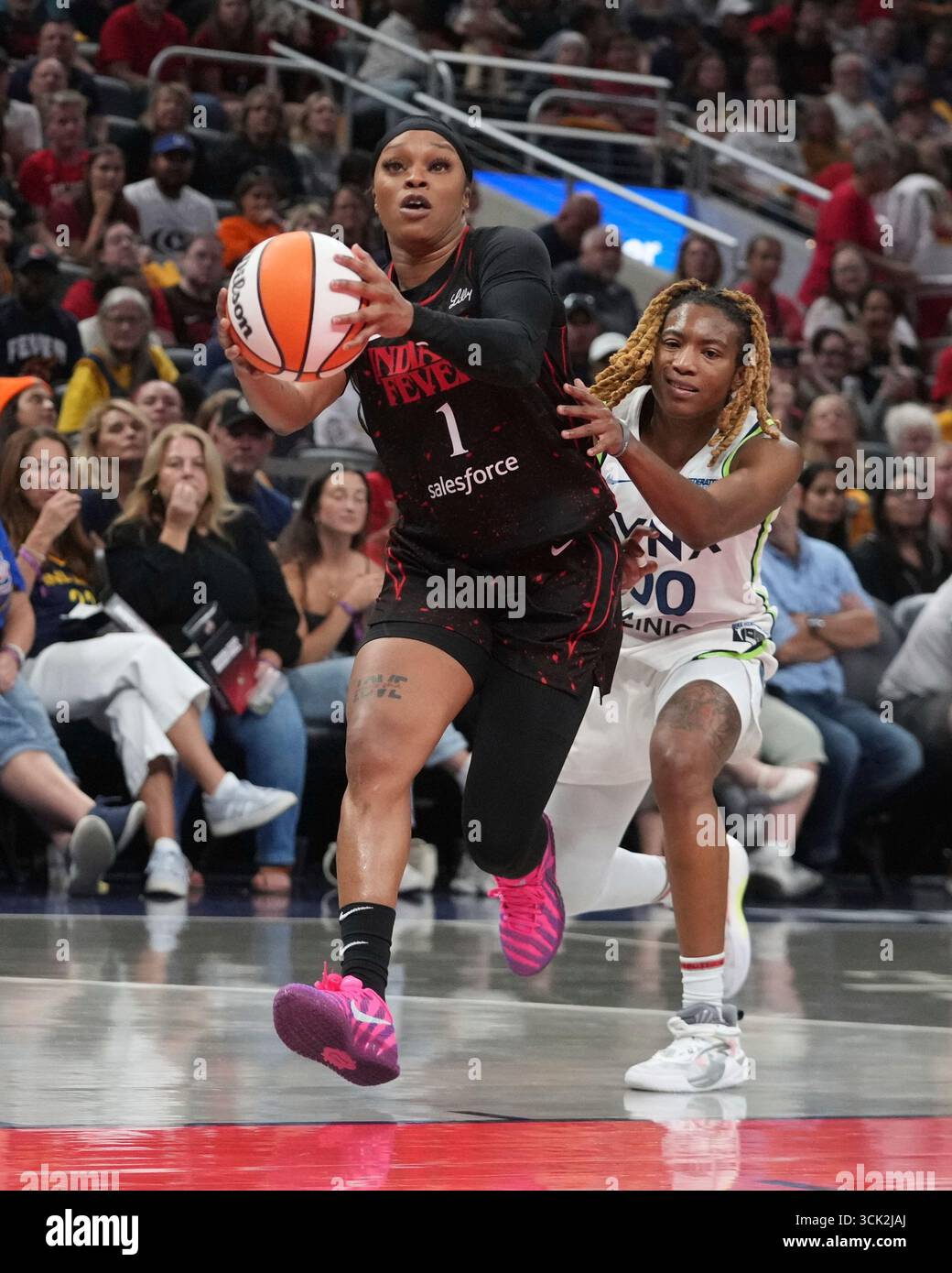 Indiana Fever's Odyssey Sims (1) goes to the basket against Minnesota ...