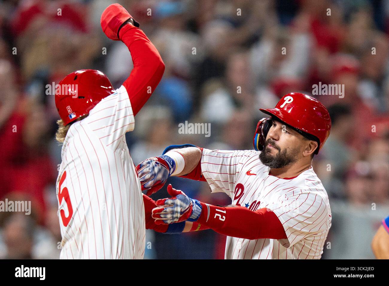 Philadelphia Phillies' Kyle Schwarber, right, reacts to his three-run ...