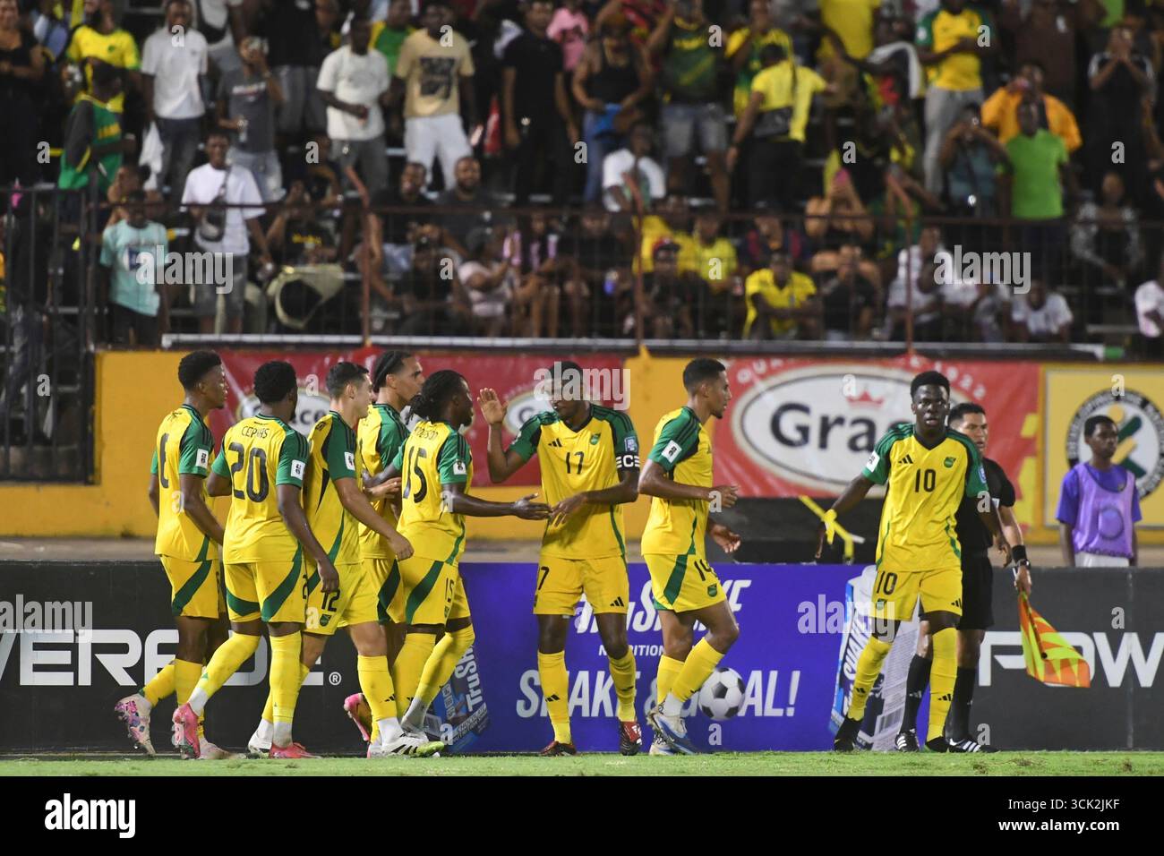 Jamaica's players celebrate their second goal against Trinidad and ...