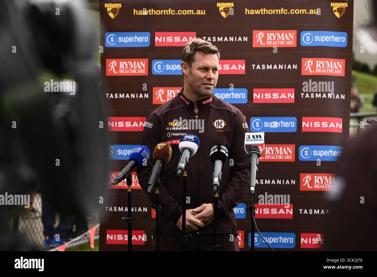 Hawthorn head coach Sam Mitchell speaks to media during an AFL training ...