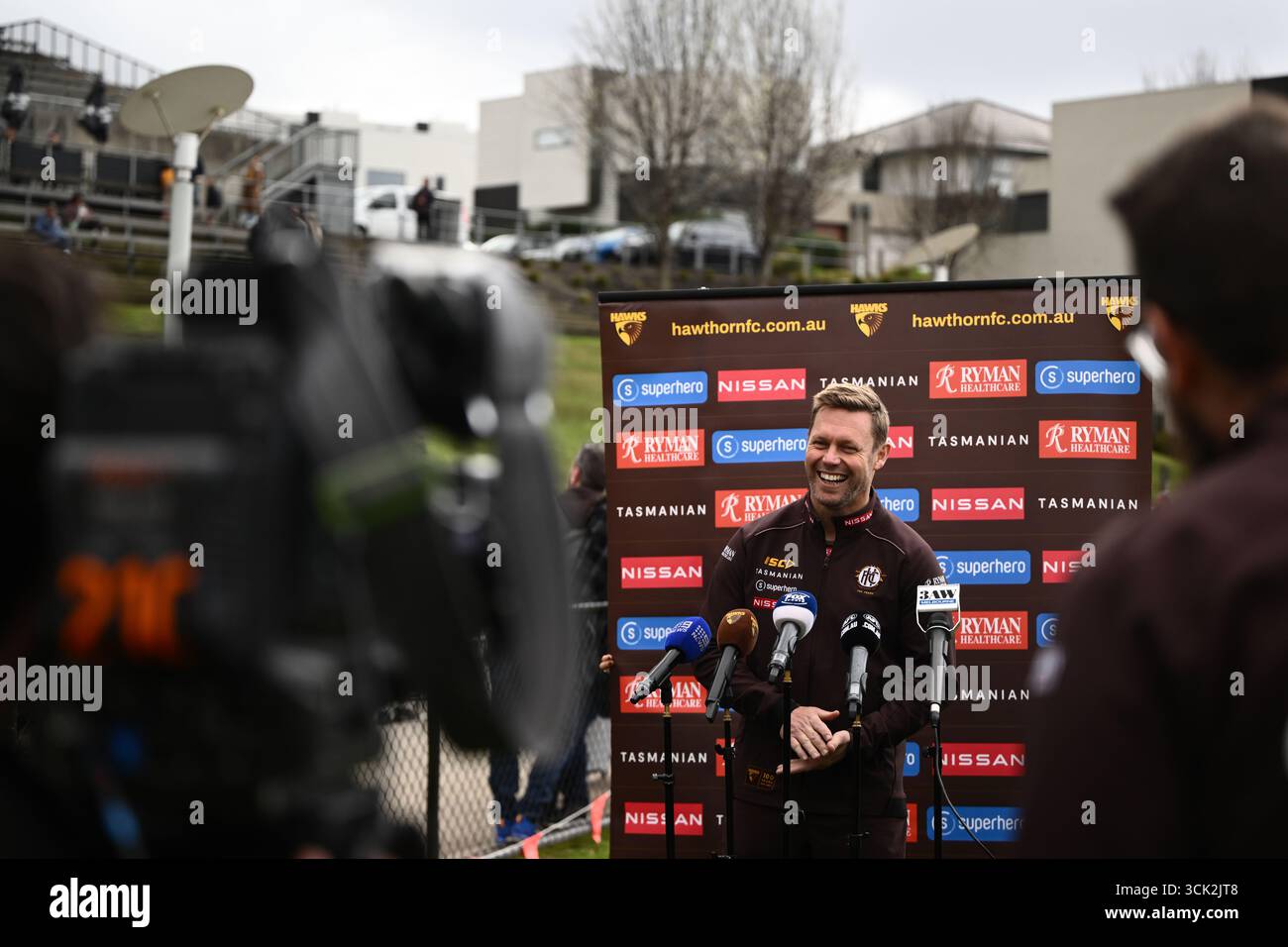 Hawthorn head coach Sam Mitchell speaks to media during an AFL training ...