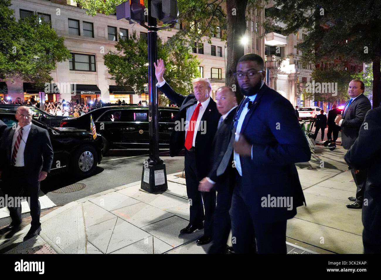 President Donald Trump waves after having dinner at Joe's Seafood ...