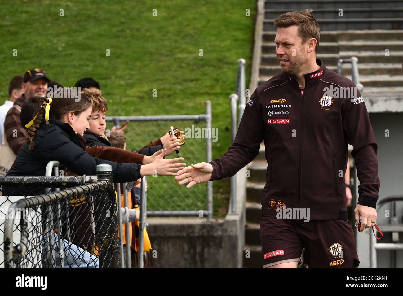 Hawthorn head coach Sam Mitchell arrives during an AFL training session ...