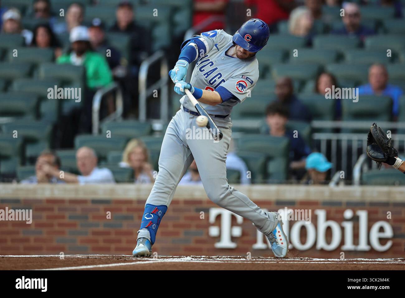Chicago Cubs' Ian Happ hits a single in the first inning of a baseball ...