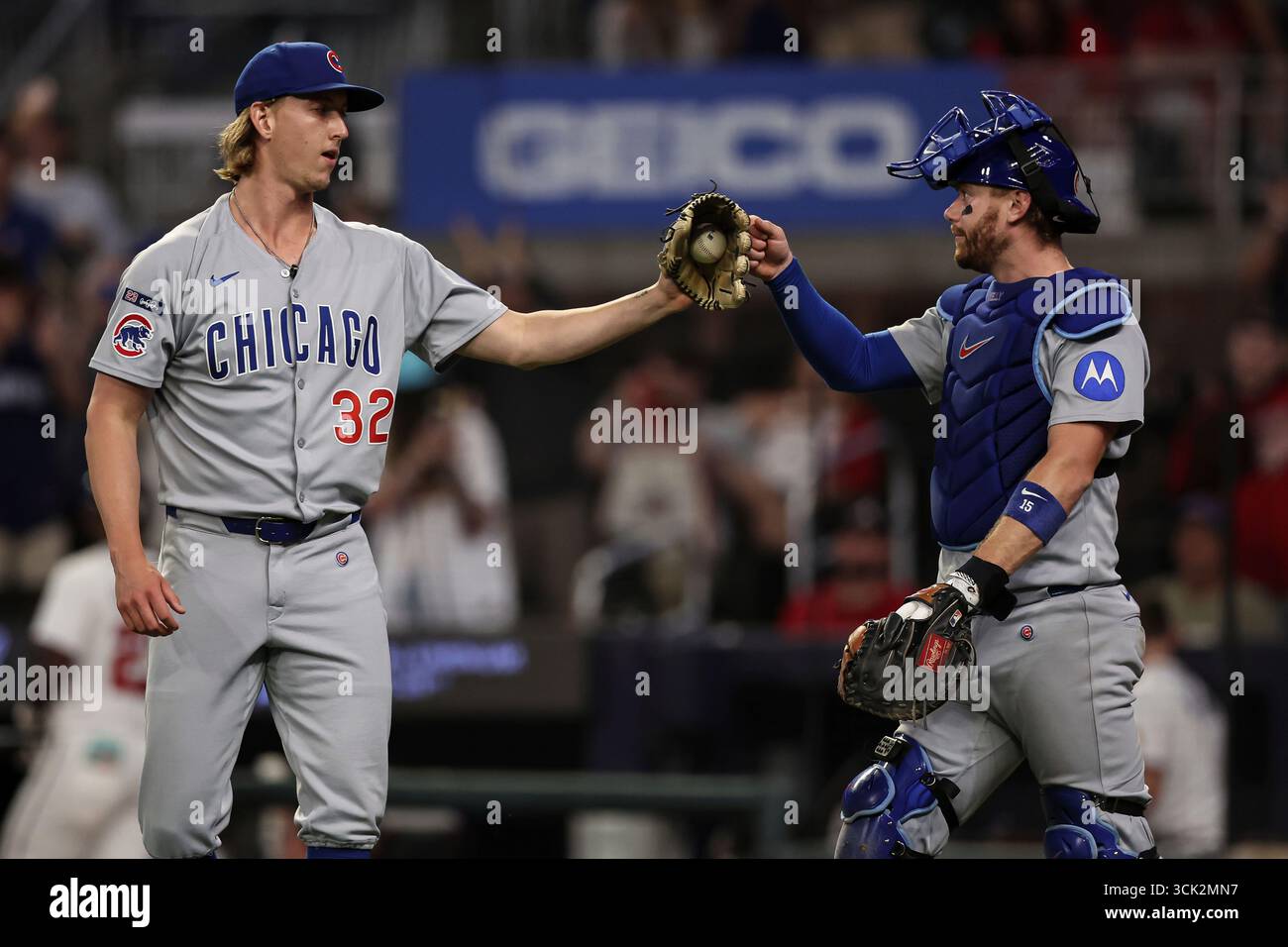 Chicago Cubs pitcher Ben Brown (32) embraces Chicago Cubs catcher ...
