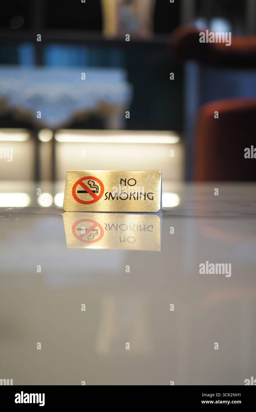 Sign indicating no smoking policy in a public area Stock Photo - Alamy