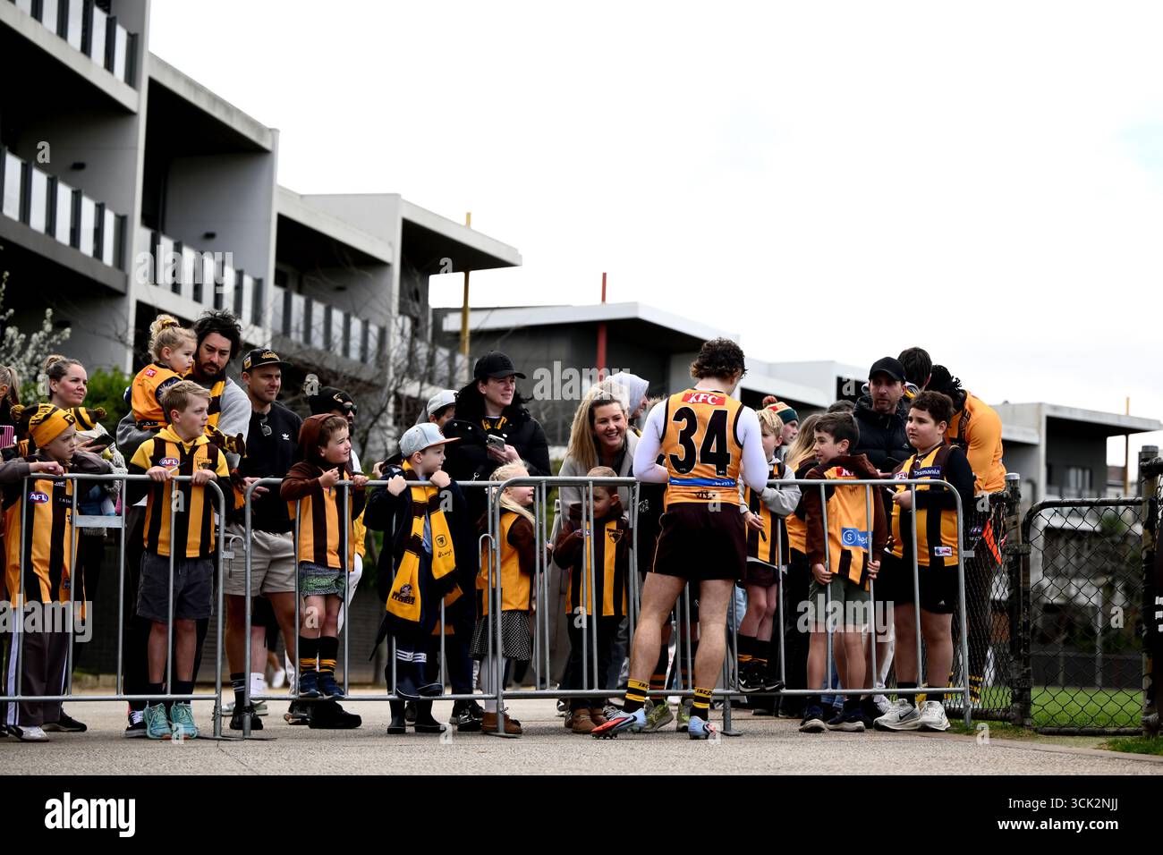 Nick Watson of the Hawks signs autographs for supporters during an AFL ...