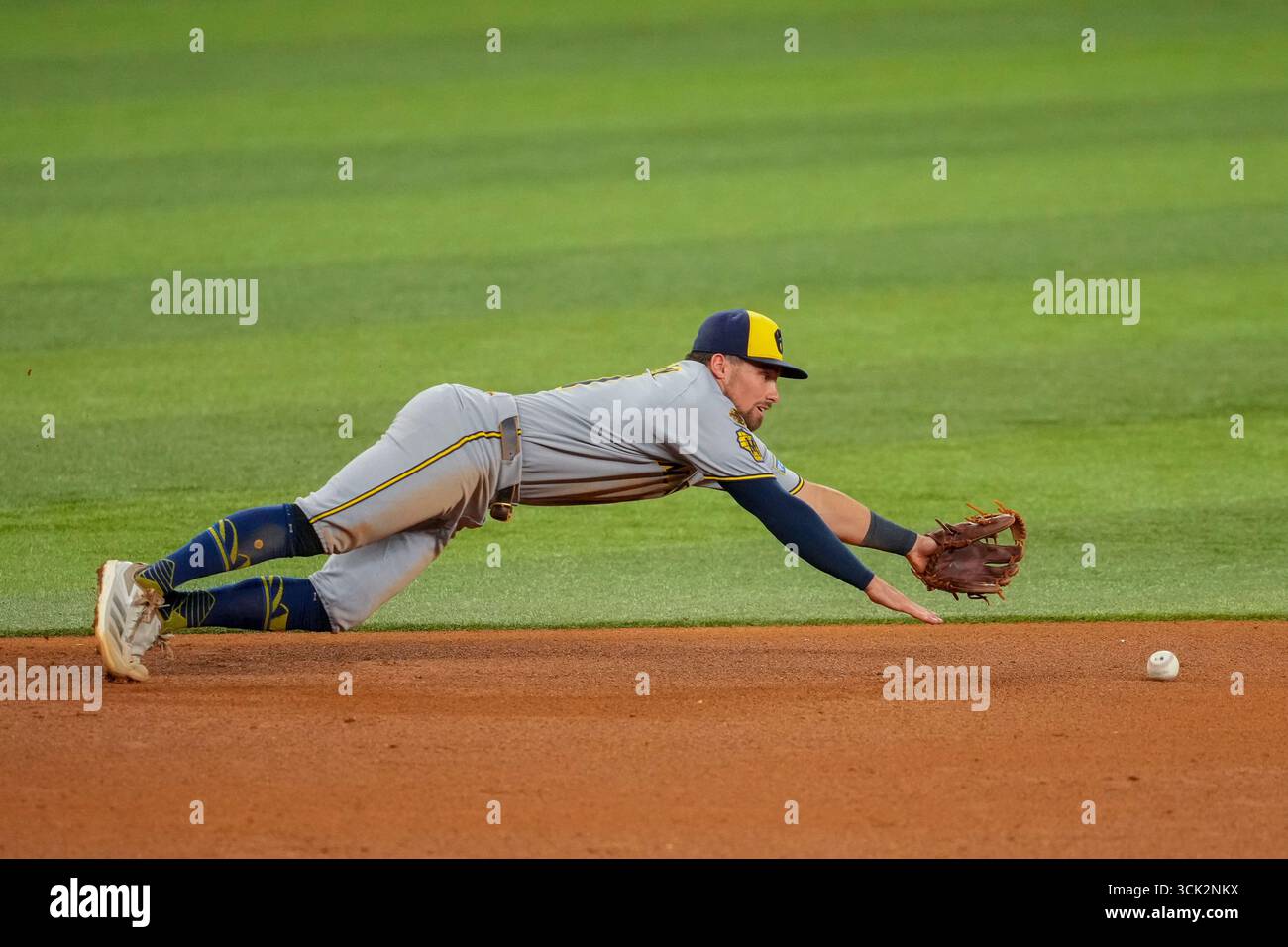 Milwaukee Brewers third baseman Caleb Durbin is unable to make a diving ...