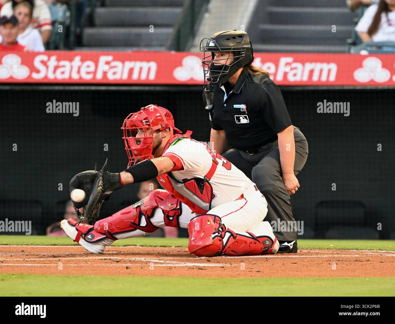ANAHEIM, CA - SEPTEMBER 09: MLB umpire Jen Pawol (65) behind Los ...