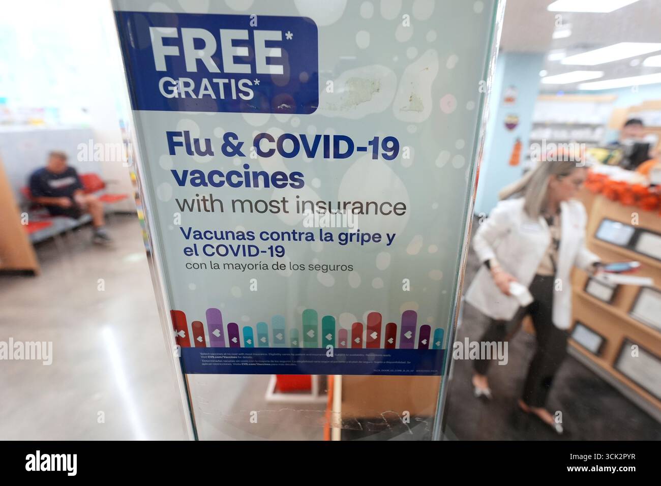 A sign advertises seasonal flu and COVID-19 vaccines at a CVS Pharmacy ...
