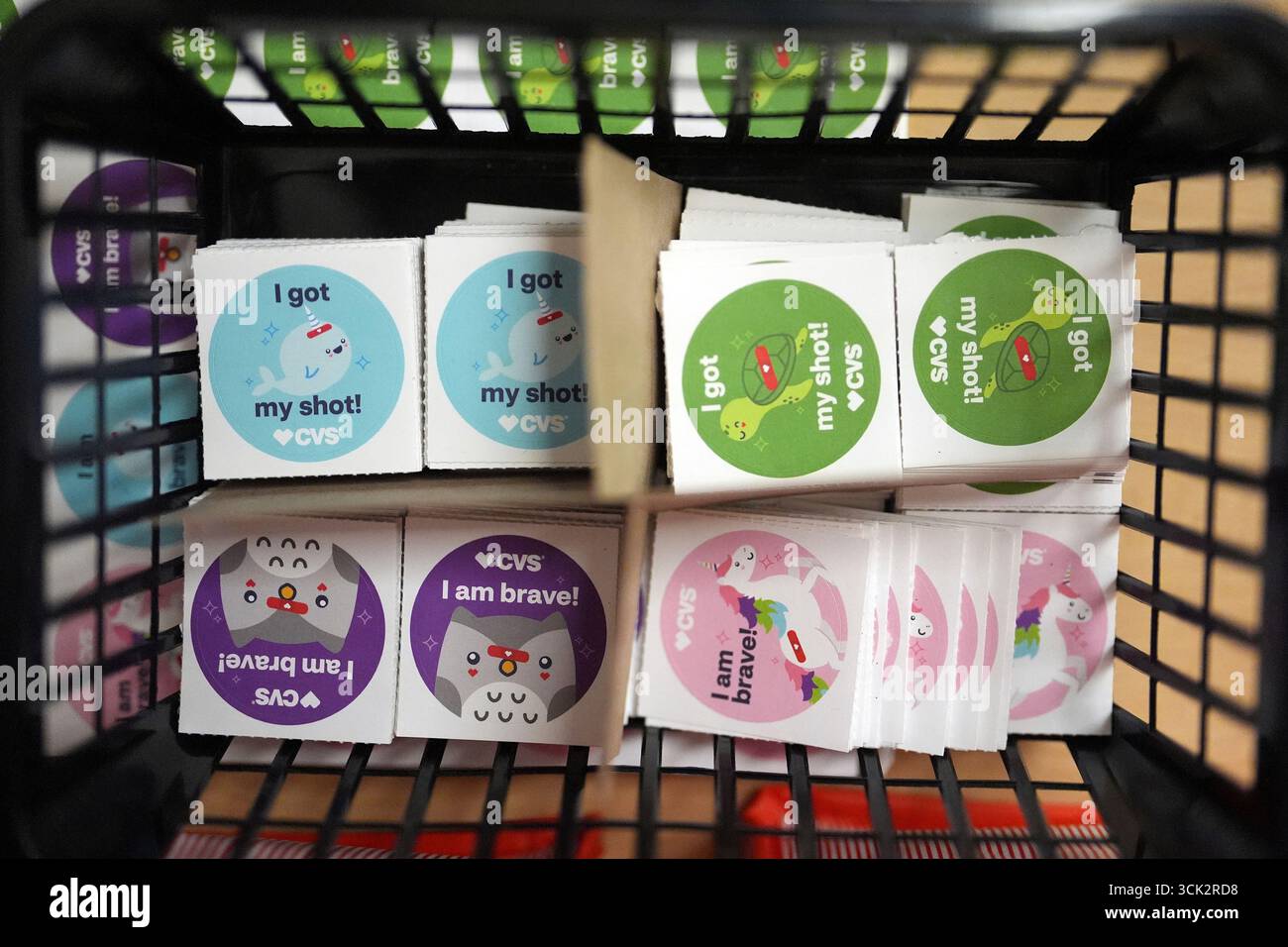 A basket holds stickers for children receiving vaccinations, at a CVS ...