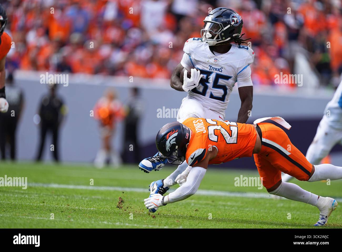 Tennessee Titans tight end Chig Okonkwo (85) spins away from Denver ...