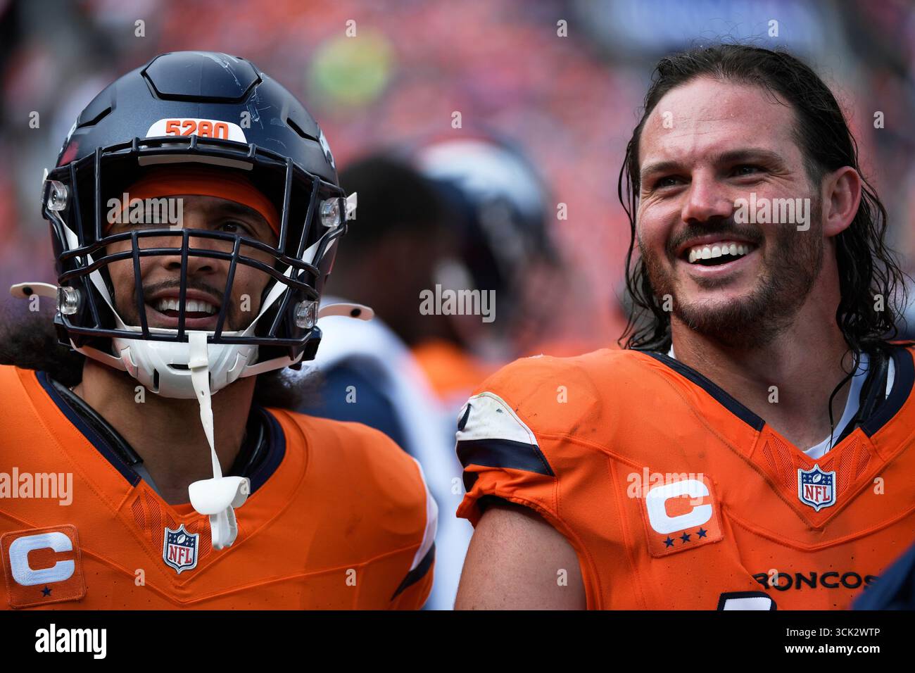 Denver Broncos safety Talanoa Hufanga (9) and linebacker Alex Singleton ...