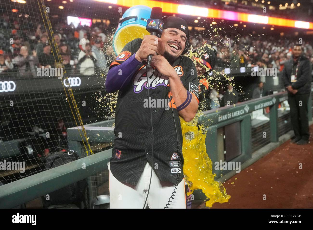 San Francisco Giants' Willy Adames, middle, is doused by Christian Koss ...