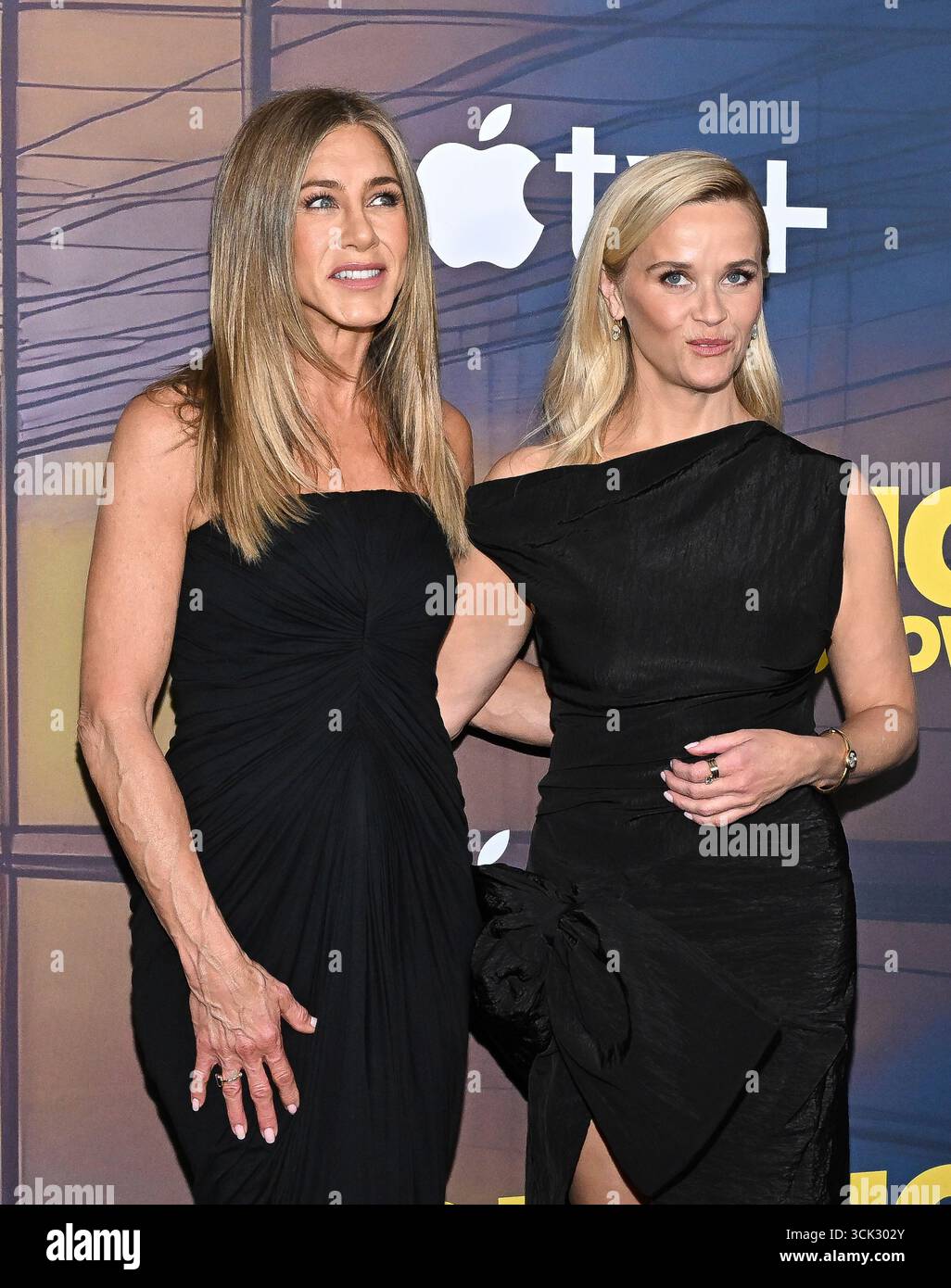 Jennifer Aniston, left, and Reese Witherspoon attend the Apple TV+ ...